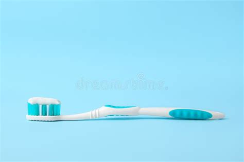 Brush With Toothpaste On Light Blue Background Space For Text Stock