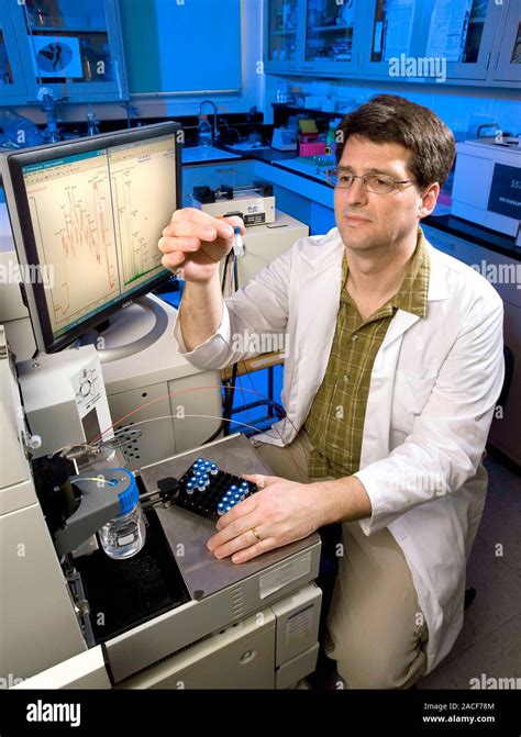 Tandem Mass Spectrometry Molecular Biologist Analysing Results From A Tandem Mass Spectrometer
