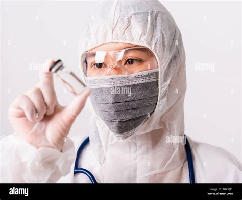 Asian Female Woman Doctor Or Nurse In Ppe Uniform And Gloves With