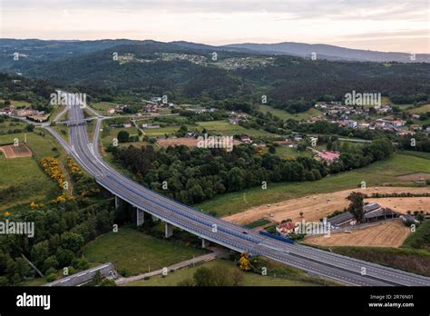 Aerial View Of Infrastructure Development Of Road With Lanes And Bridge