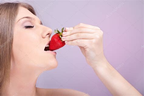 Sensual Biting Strawberry Stock Photo By Luckybusiness 5997324