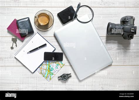 View Of A Wooden Table With A Laptop External Hdd Usb Cable Mobile Notebook Camera Pen