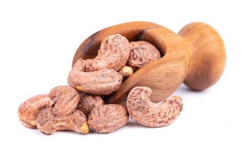 Premium Photo Cashew Nuts In Shell In Wooden Scoop Isolated On White Background Roasted And