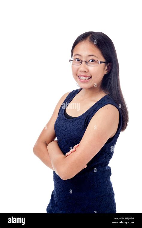Cute Asian Girl In Braces Striking A Confident Pose Isolated On White Stock Photo Alamy
