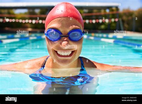 The Pool Is Like A Second Home Closeup Portrait Of A Female Swimmer Treading Water In A