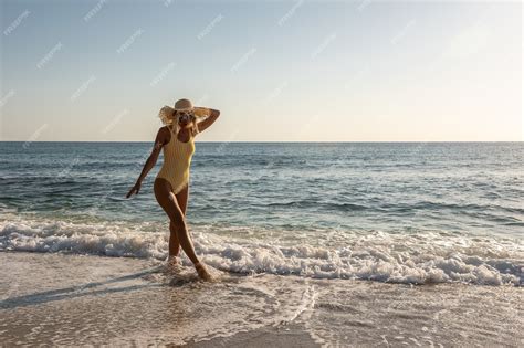 Premium Photo Gorgeous Fashion Model In Swimsuit On A Sand Beach