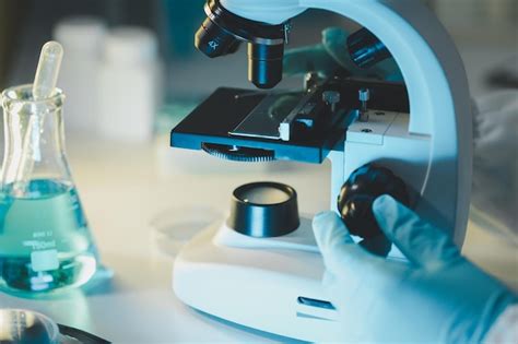 Premium Photo Female Medic In Uniform Working With Microscope Making Analysis At The