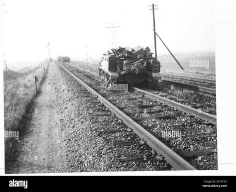 Same Story Carriers Of A Mortar Platoon Advance Astride The Railway Track To Hertogenbosh