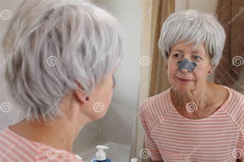 Senior Woman Using A Nose Strip To Remove Black Dots Stock Image Image Of Peel Nose 285051623