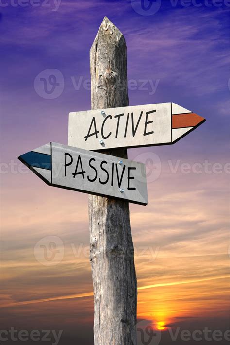 Active And Passive Signpost With Two Arrows Sunset Sky In Background