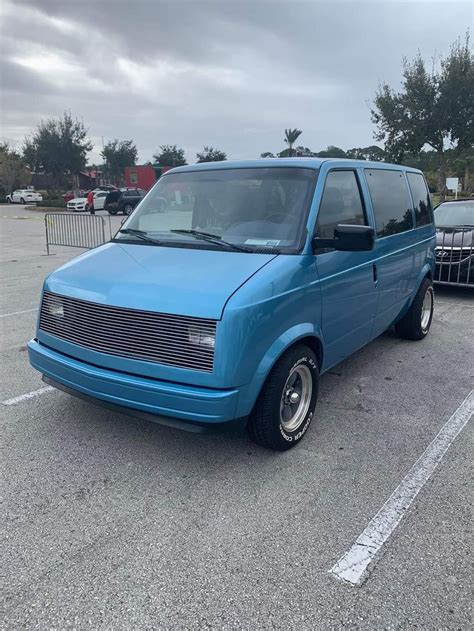 Blue Van Parked In A Parking Lot Ford Astro Van Teal Astro Van