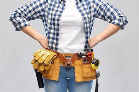 Premium Photo Woman Or Builder With Working Tools On Belt