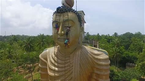 වැවුරුකන්නල බුදු රජ මහා විහාරස්ථානයේ සියක් රියන් මහා බුද්ධ ප්‍රතිමාව දෝවනය කි‍රීම Youtube