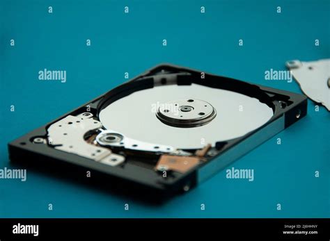 close up of abstract image of inside of hard disk drive on blue cover background concept of