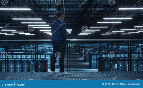 Data Center Engineer Using Laptop Computer Server Farm Cloud Computing Specialist Facility With