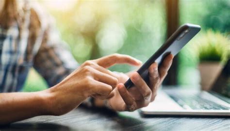 Premium Photo Hand Using A Phone At Home Capturing The Essence Of Modern Connectivity And