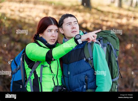 Woman And Man Pointing Finger In Park Stock Photo Alamy