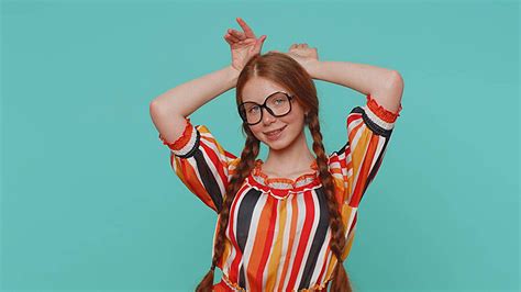 Flashing Smile Of A Redhead Girl With A Usb Drive In Hand Mp3 Player