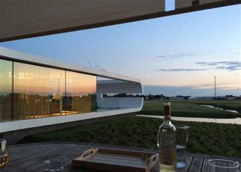 Corian Facade Wraps Around Waterside Dutch Home