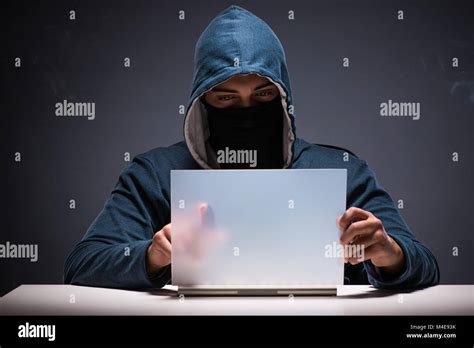 Computer Hacker Working In Dark Room Stock Photo Alamy