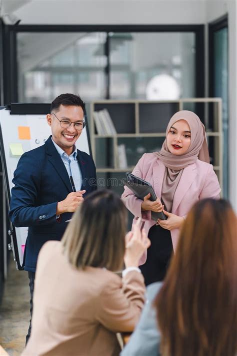 Professional Diverse Business Team Presenting And Discussing Data