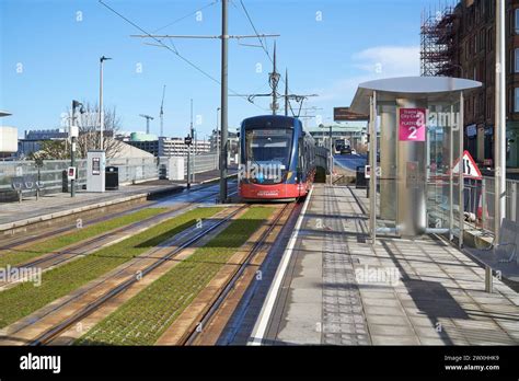 Tram Approaching A Platform In Newhaven Edinburgh Scotland Stock