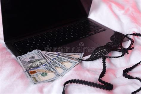 Prostitution And Virtual Sex Laptop Dollar Banknotes And Mask On