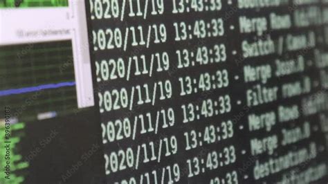 Stockvideon White Computer Software Code Moving On A Black Monitor Reflect On Glass Defocused