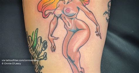 Comic Style Pin Up Tattoo On The Thigh