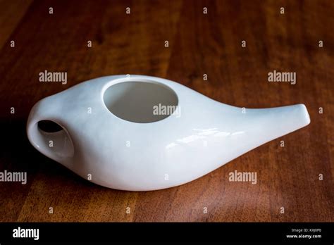 Neti Pot Ayurvedic Tools For Cleaning Nose With Water And Pink Salt From Hymalaia Isolated On