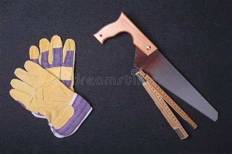 Orange Hard Hat Safety Glasses Gloves Saw And Measuring Tape On Wooden Background You Can