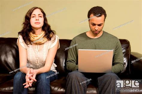 Man Working On Computer While Woman Looks On Stock Photo Picture And Royalty Free Image Pic
