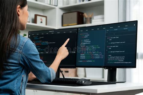 Young Asian In It Developer Pointing Online Information On Pc