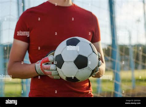 Soccer Goalie Gloves Holding A Ball
