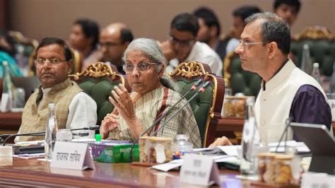 Gst Meet Sitharaman Announces Biometric Aadhaar Authentication