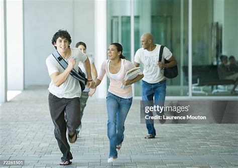 College Student Running To Class Photos And Premium High Res Pictures