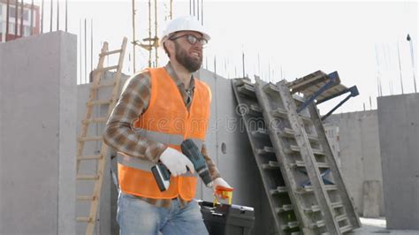 Positive Dance Of Builders In Helmet Construction Engineer In Builder Uniform Dancing On His