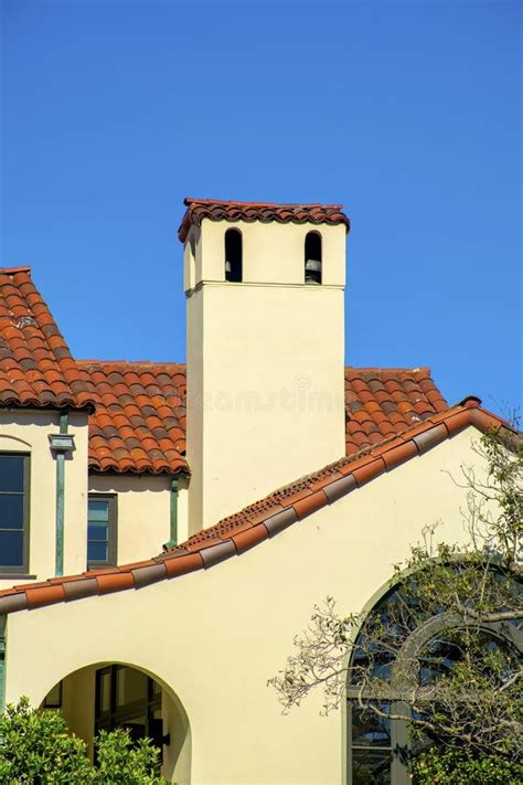 White House Facade Exterior With Red Or Orange Roof Tiles And Front