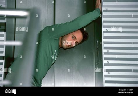 Man Leans In Front Of An Intercom Stock Photo Alamy