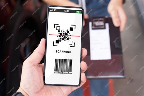 Premium Photo Female Hand Holding Black Mobile Phone With Qr Code On The Screen Scanning The