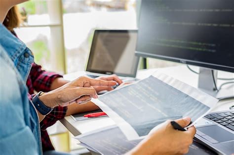 Premium Photo Cropped Image Of Male Computer Programmer Coding In Office