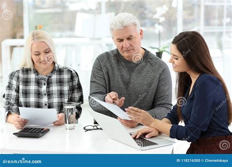 Mature Couple Discussing Pension With Consultant In Office Stock Photo Image Of Finance