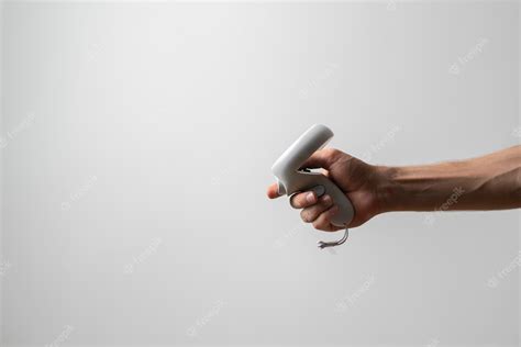 Premium Photo A Gamer Holding A Wireless Joystick Controller Pushing The Buttons