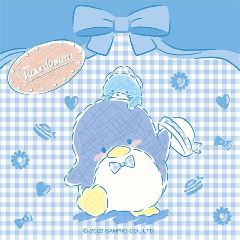 A Blue And White Background With A Penguin Wearing A Knitted Hat Scarf And Bow