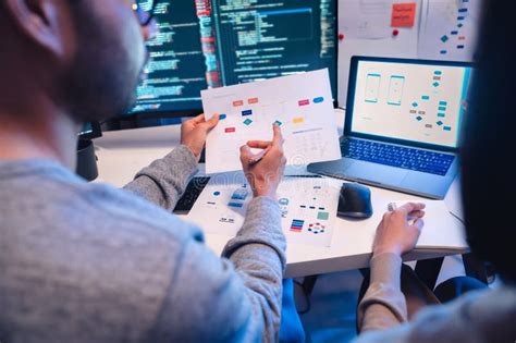 Asian Software Developers Teams Working On Multiple Screens Displaying