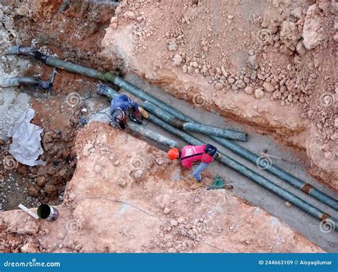 Installing Underground Downspout Drain Line Sewer Line Or Waste Pipe In A Trench Laying Pvc