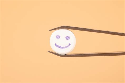 Premium Photo Smile Tablet Lsd Trip Happy Psychedelic Pill Drug Closeup