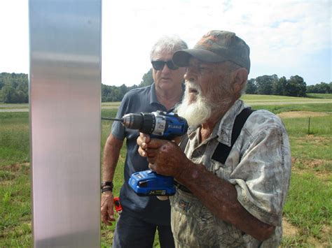 Raybern Attaching Plaque Christian Cross Ministries