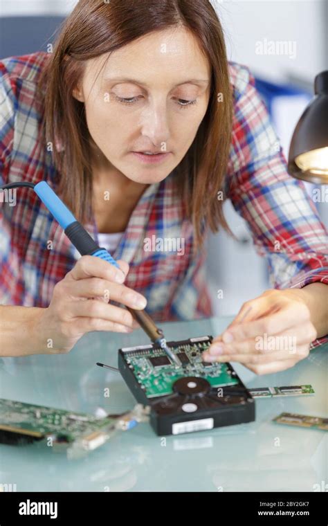Female Engineer Fixing Broken Computer Hard Drive Stock Photo Alamy