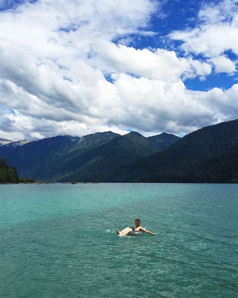 Babe Woman Floating In A Lake By Stocksy Contributor Jesse Weinberg Stocksy